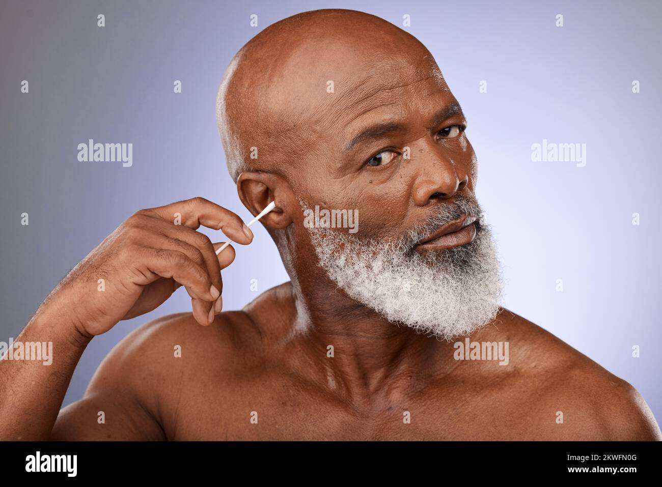 Black man, cleaning ear and cotton bud for hygiene, wellness and wax ...