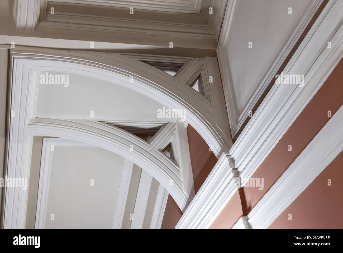 White cantilevers holding a ceiling structure. Classic interior design ...