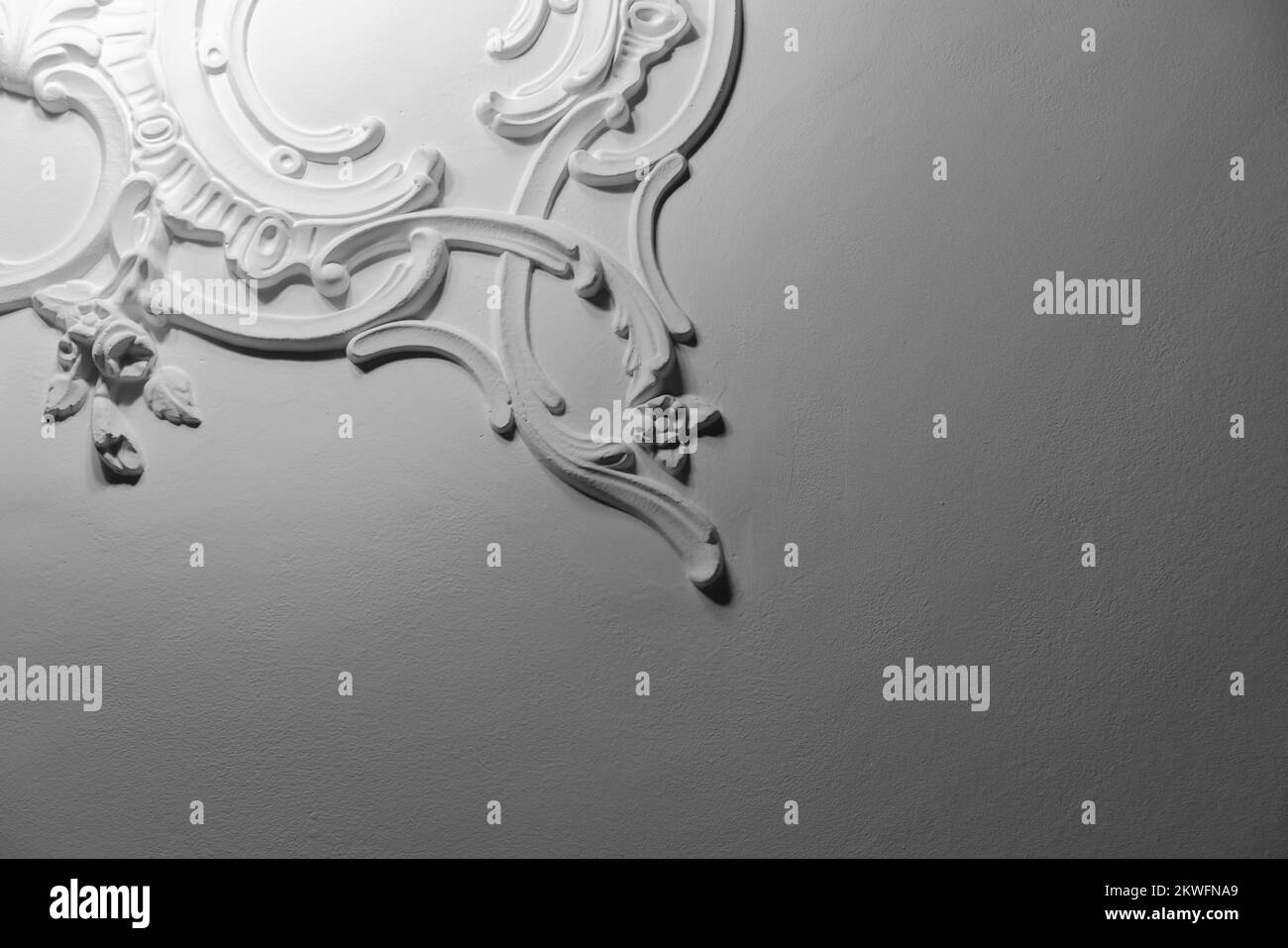 White bas-relief ceiling design details in rococo style, classic ...