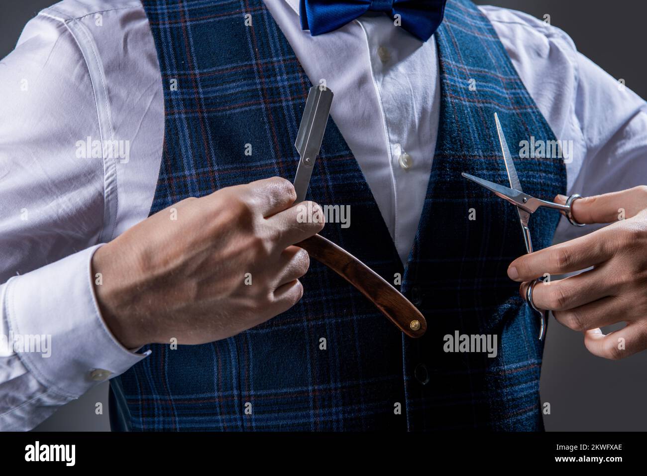 closeup view of barbershop man. man with barbershop scissors and blade ...