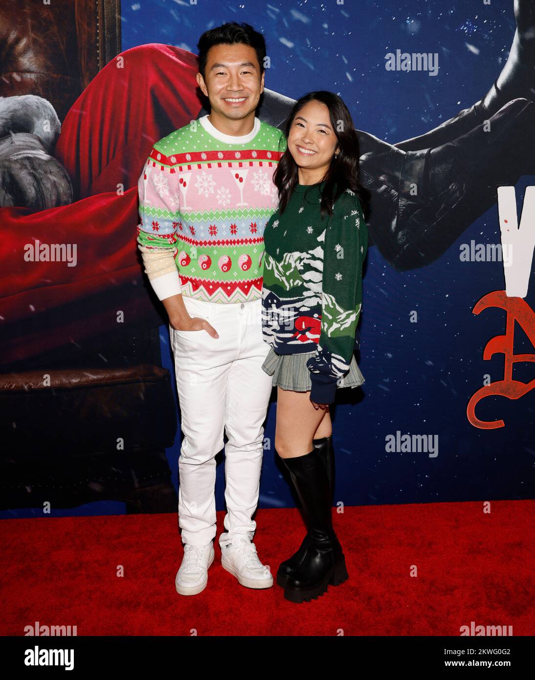 Los Angeles, CA, - Nov 29, 2022: Simu Liu and guest arrive at the movie premiere of "Violent ...