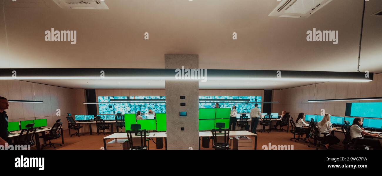 Group of Security data center operators working in a CCTV monitoring ...