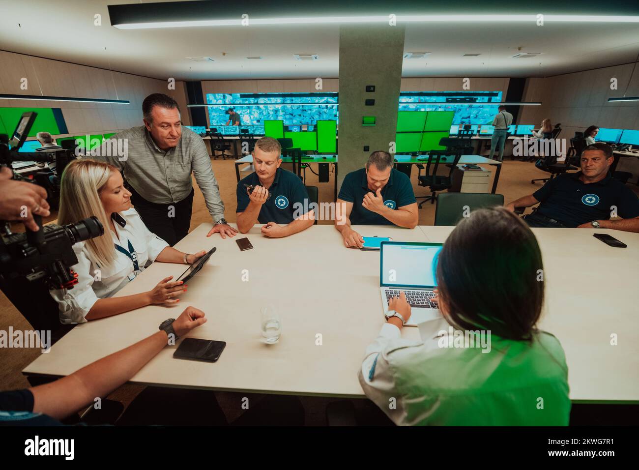 Group of security guards sitting and having briefing In the system ...