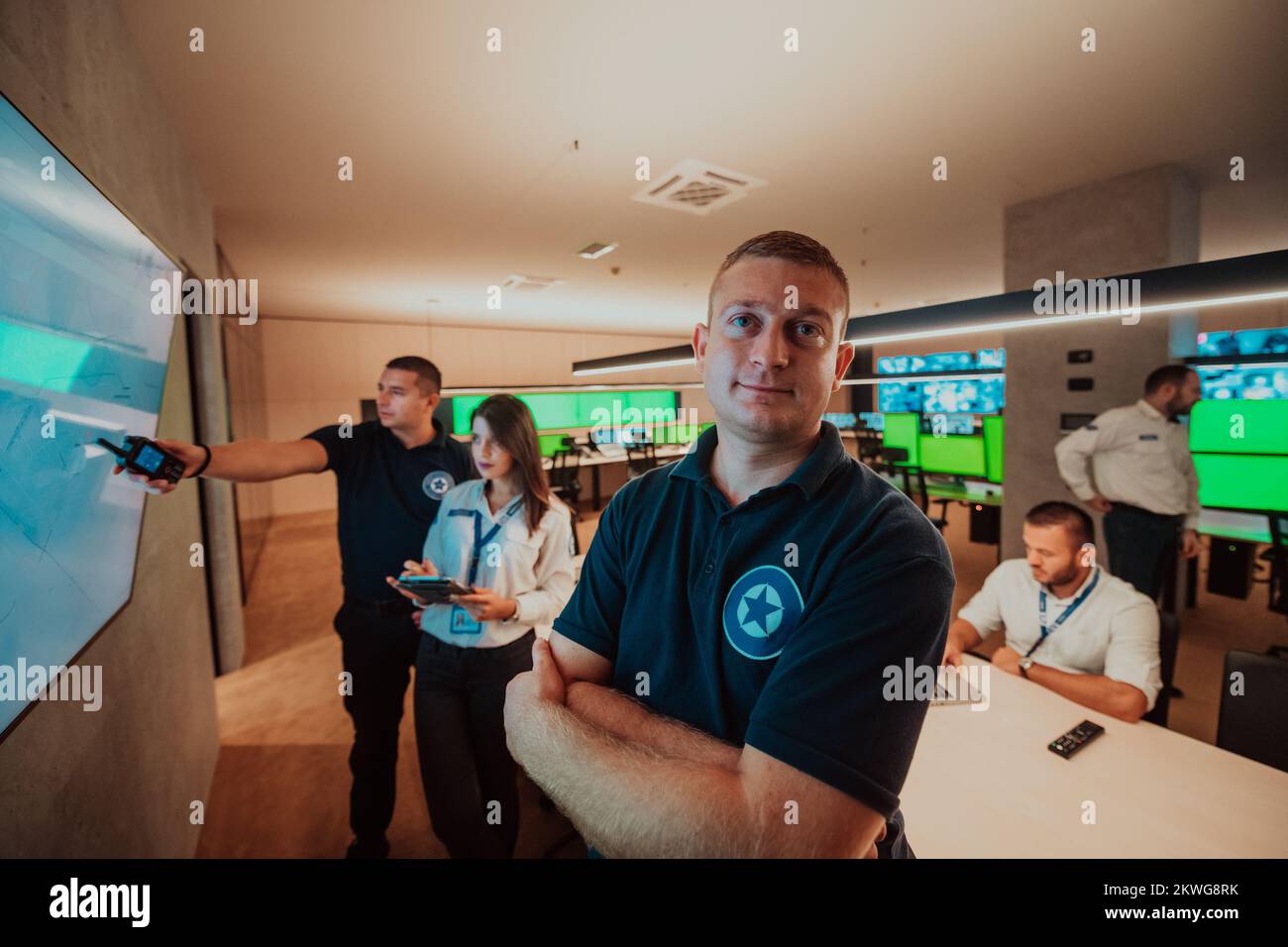 Group of Security data center operators working in a CCTV monitoring ...