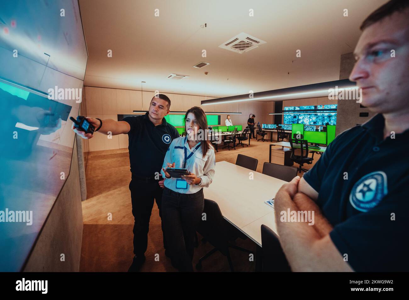 Group of Security data center operators working in a CCTV monitoring ...