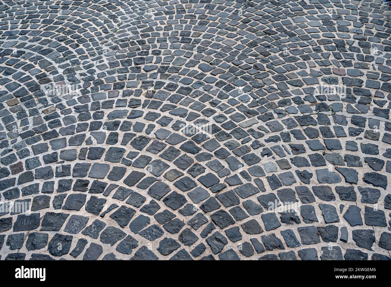 Pavers laid in arcs as background or texture Stock Photo - Alamy