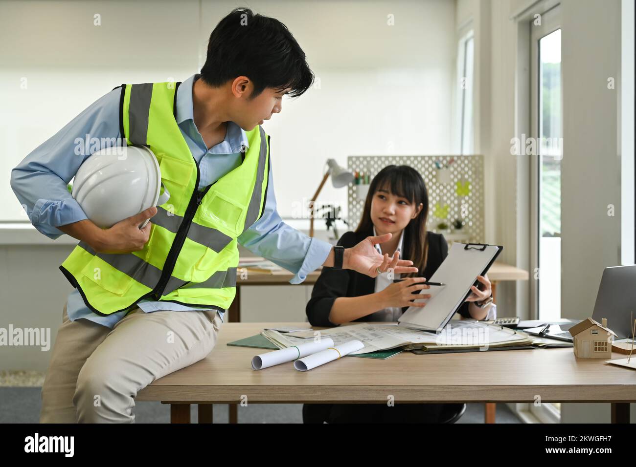 Engineer or architect team brainstorming, planning development details ...