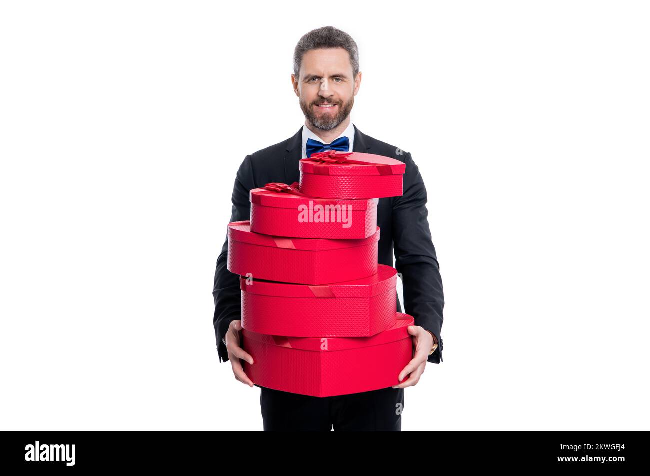 man with heap of valentines day gift in studio. tuxedo man hold ...