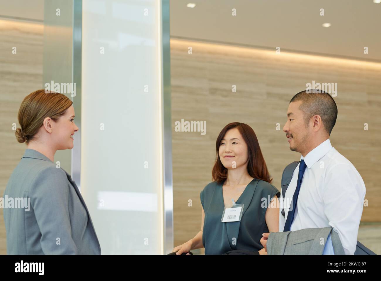 Business people, hotel concierge and check in at luxury hospitality ...