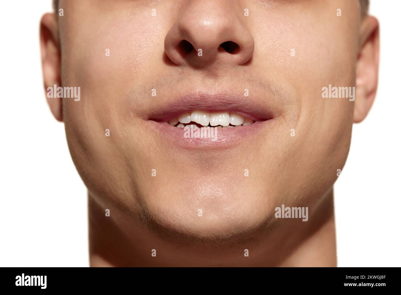 Cropped face of young man with well-kept skin isolated on white studio ...