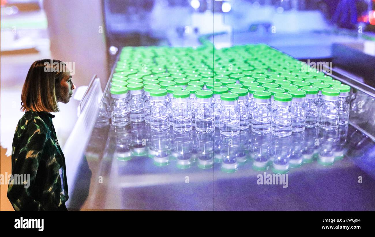 London, UK. 30th Nov, 2022. Museum staff pose with images of a vaccine ...