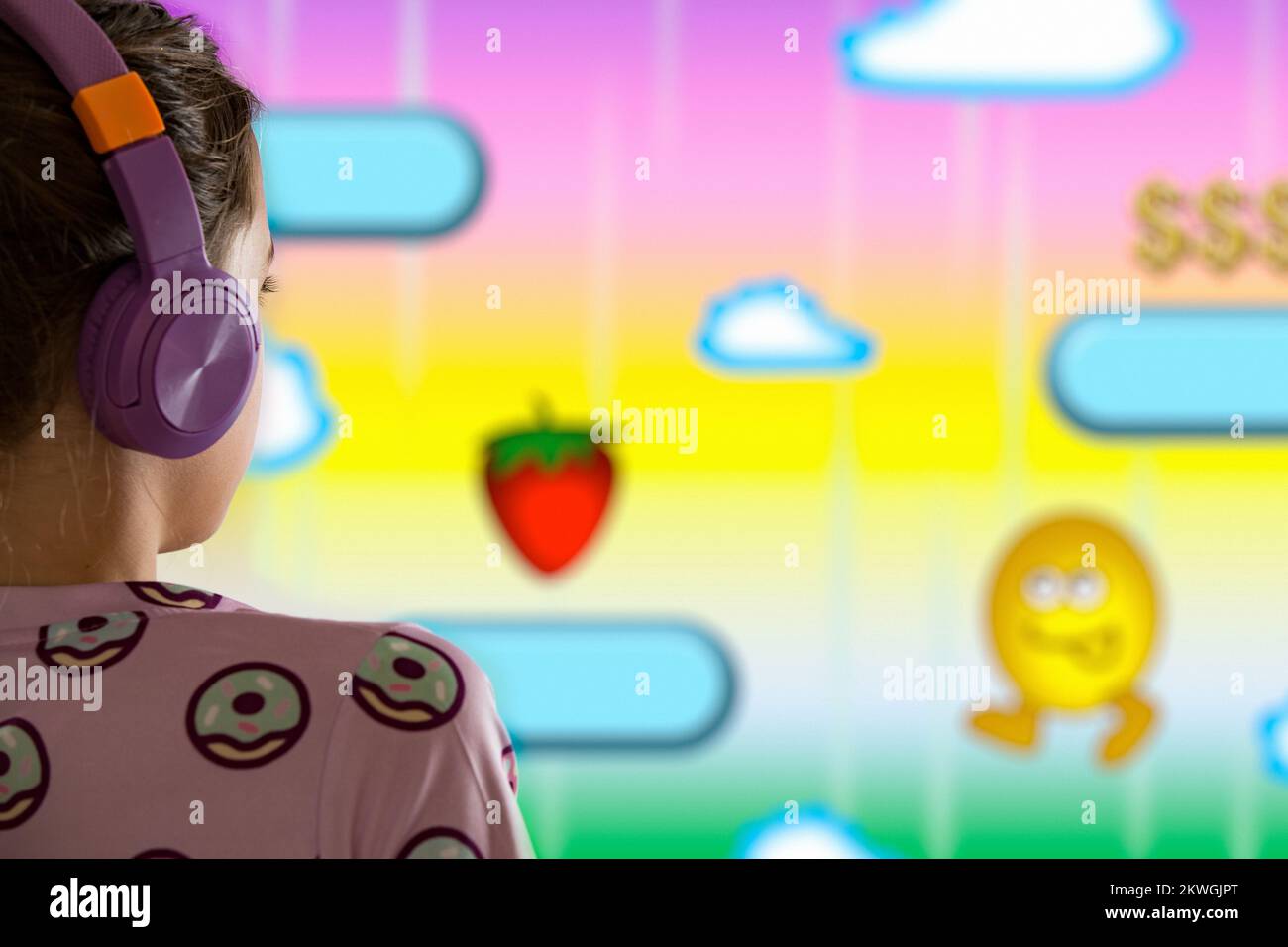 A child or teenager is playing computer video games on a large screen ...