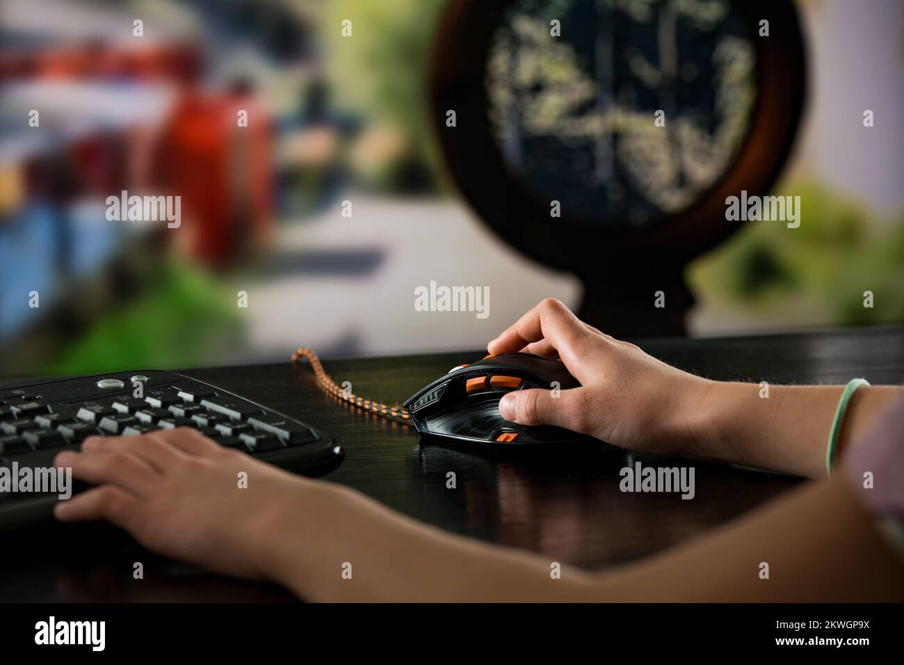 A child or teenager is playing computer video games on a large screen ...