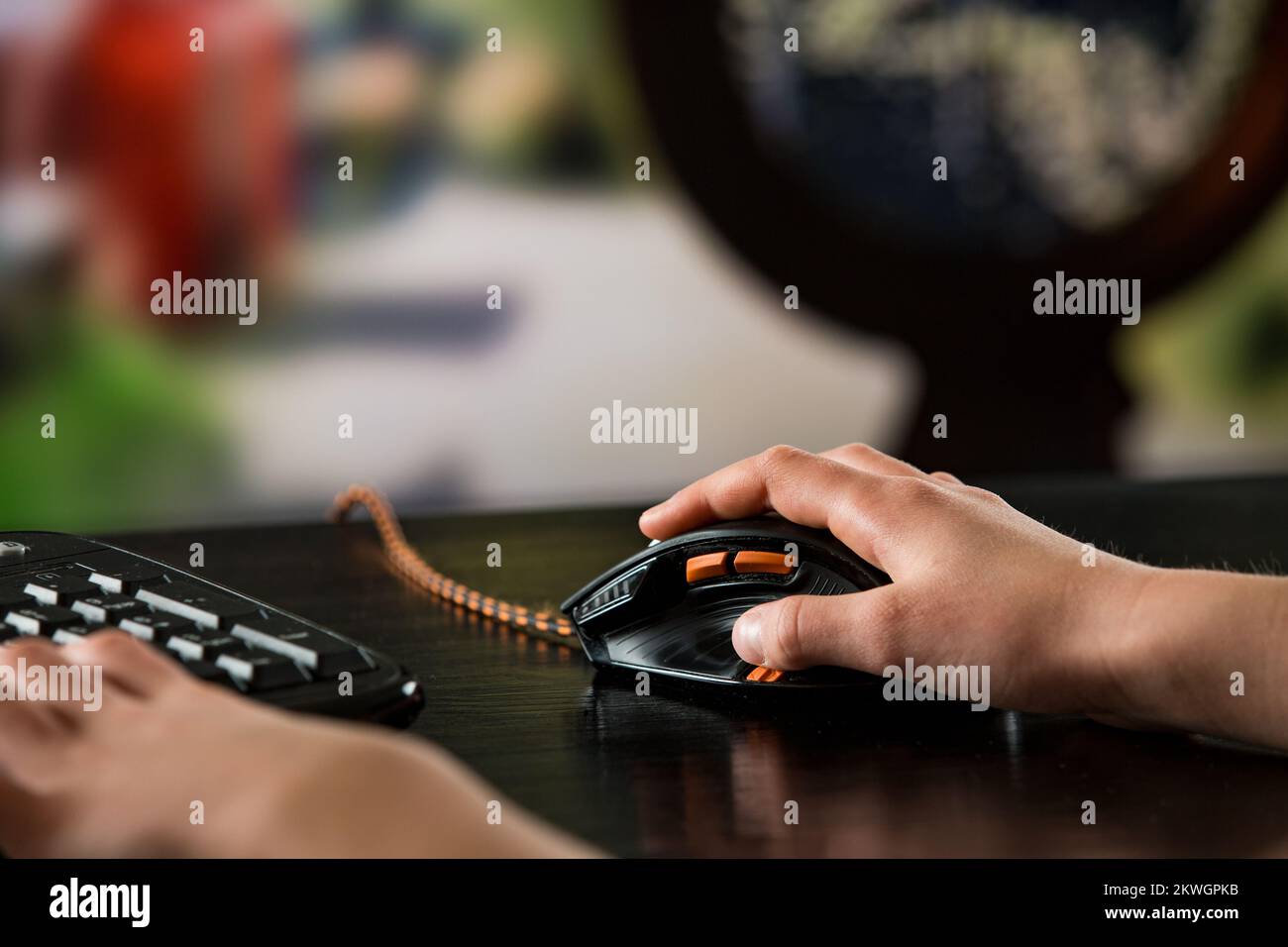 A child or teenager is playing computer video games on a large screen ...