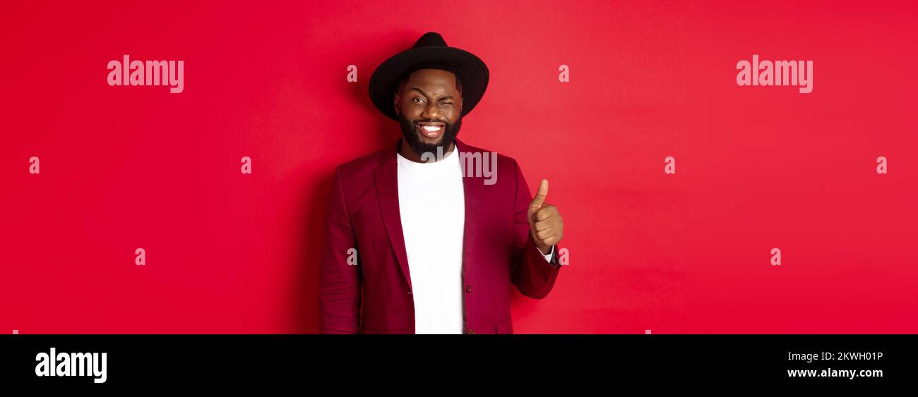 Christmas shopping and people concept. Handsome bearded Black man in ...