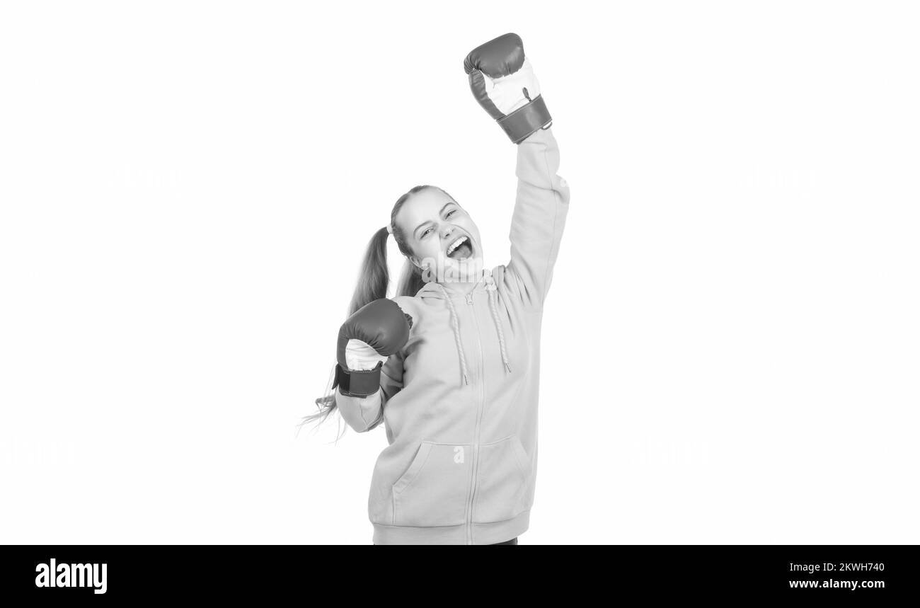 happy teen girl boxer in boxing gloves celebrating victory in fight ...