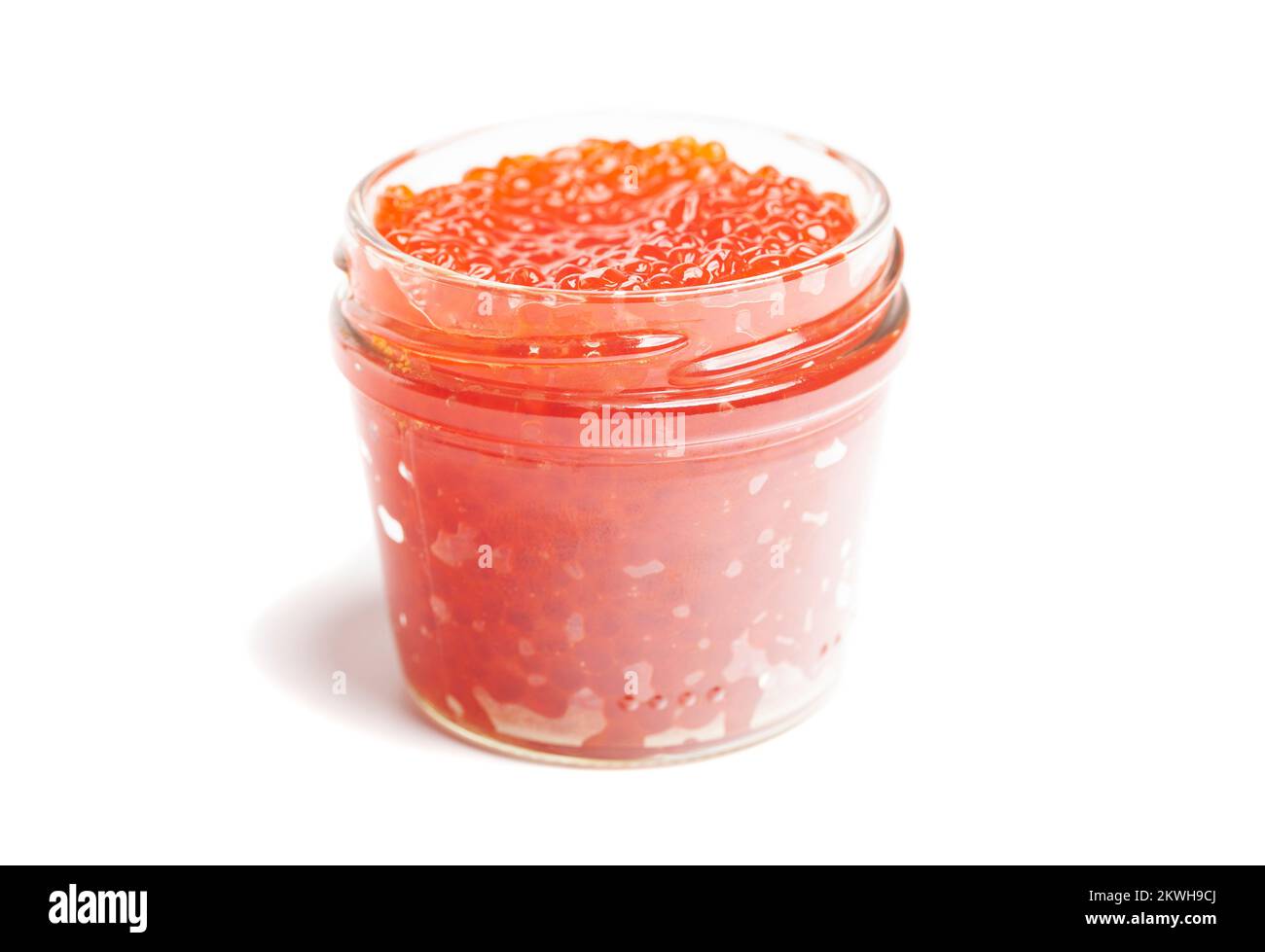 Glass jar with delicious red caviar isolated on white background Stock ...
