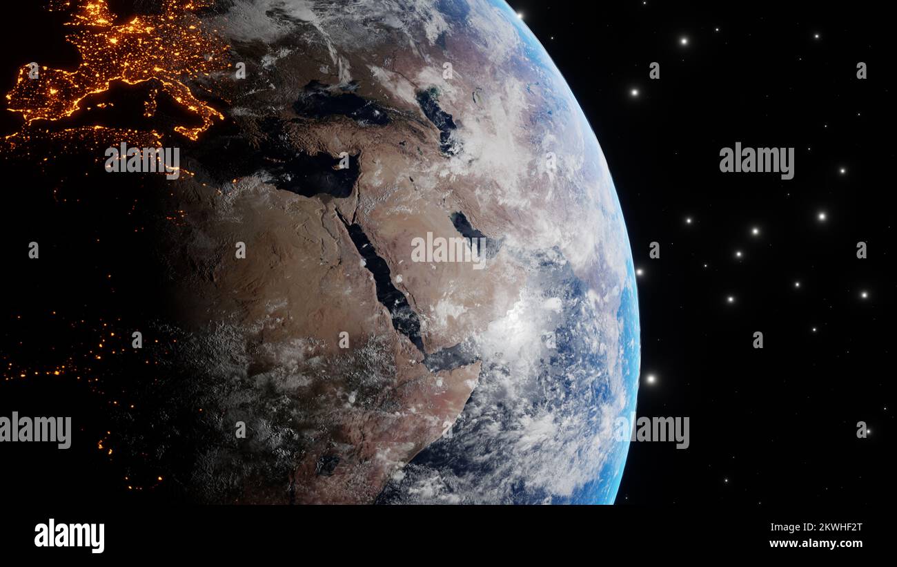 Earth slowly rotating in space, backlit by the sun with the lights of ...