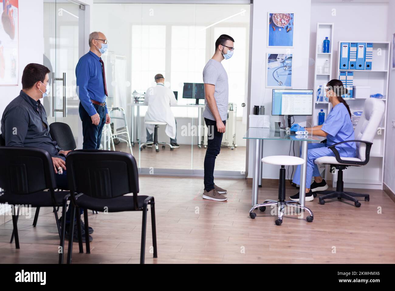 Elderly patient in hospital waiting area for coronavirus examination ...