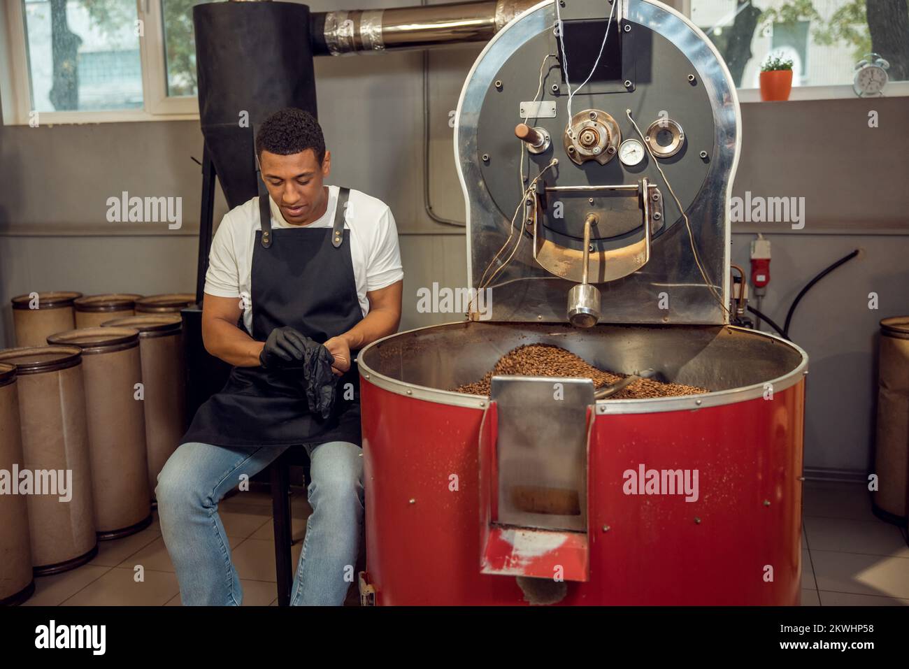 Professional African American roast master preparing for work Stock ...