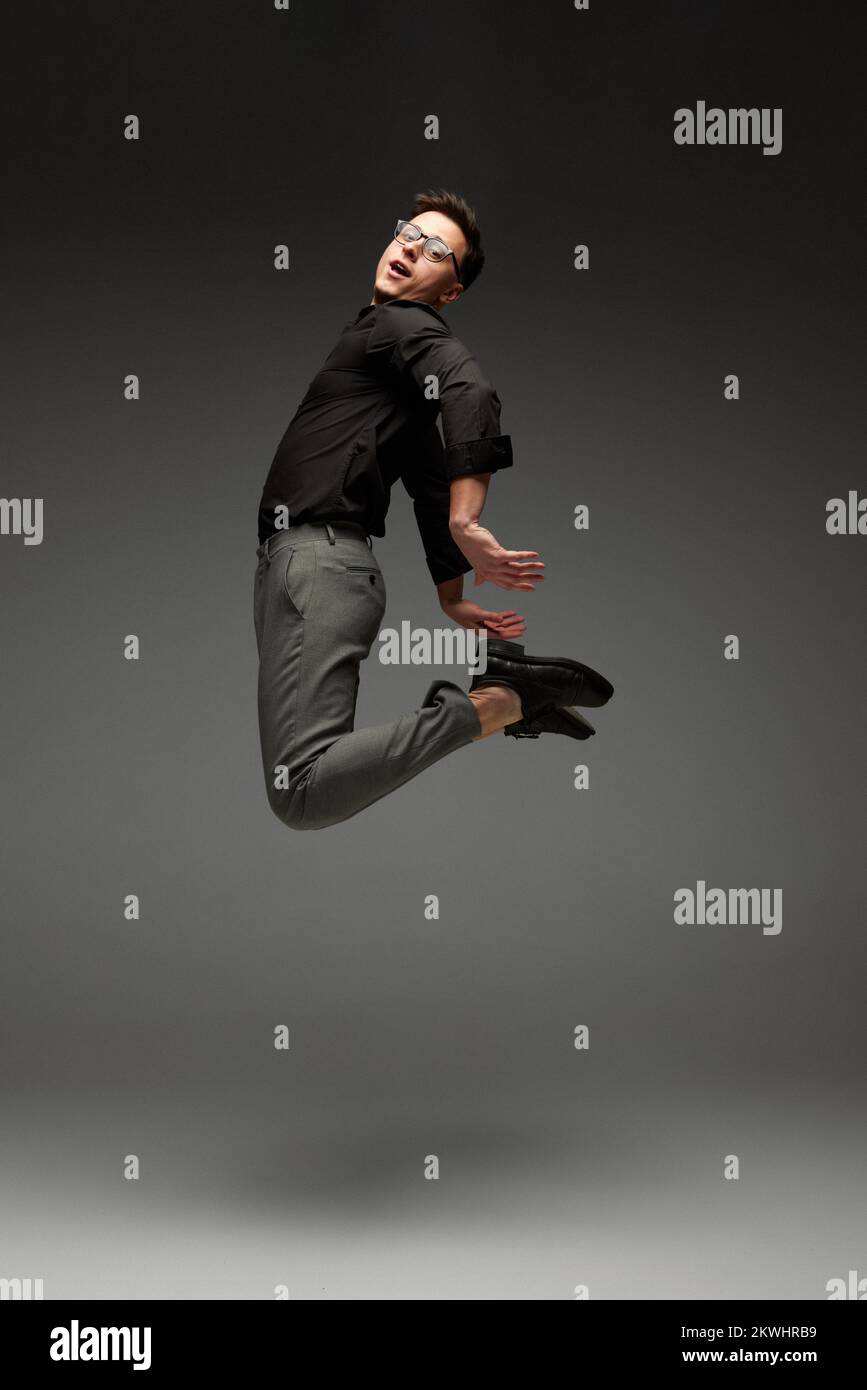 Freedom. Happy young man, student, business in black classic style ...