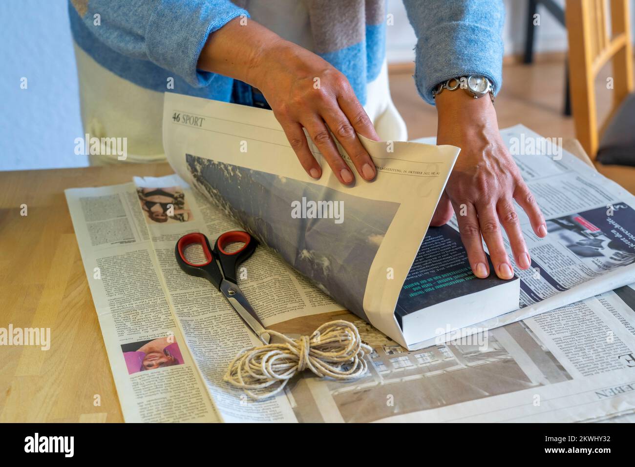Sustainable gift wrapping, in newspaper, without adhesive tape, just ...