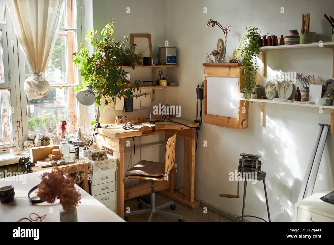 Background image of cozy workshop studio lit by sunlight with wooden ...