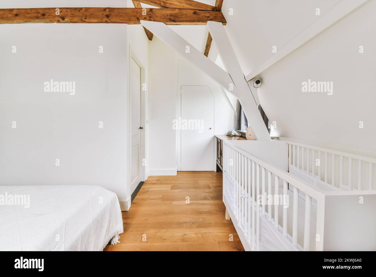 Home interior design of bedroom with bed and wooden wardrobe placed in ...