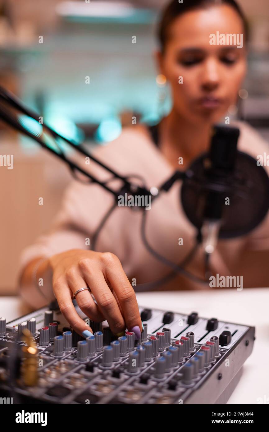 Influencer in entertainment industry smiling and checking sound during ...