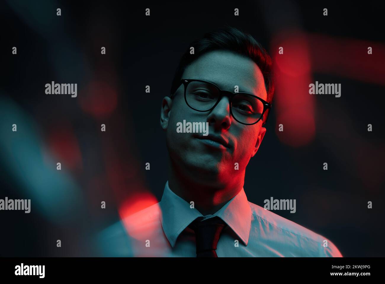 Cinematic night closeup portrait of handsome man neon lights. Fashion ...