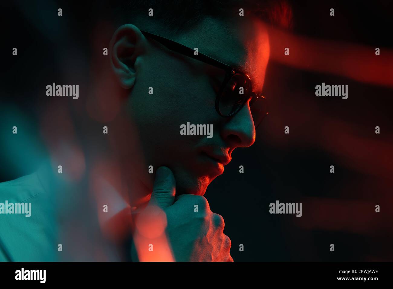 Cinematic night closeup portrait of handsome man neon lights. Fashion ...