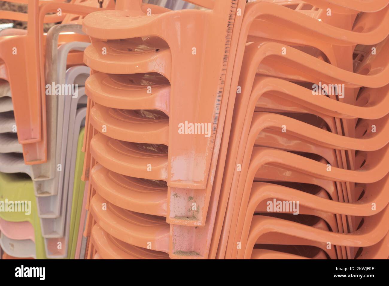 infrared image of the lots of stacked up plastic air chair at the park ...
