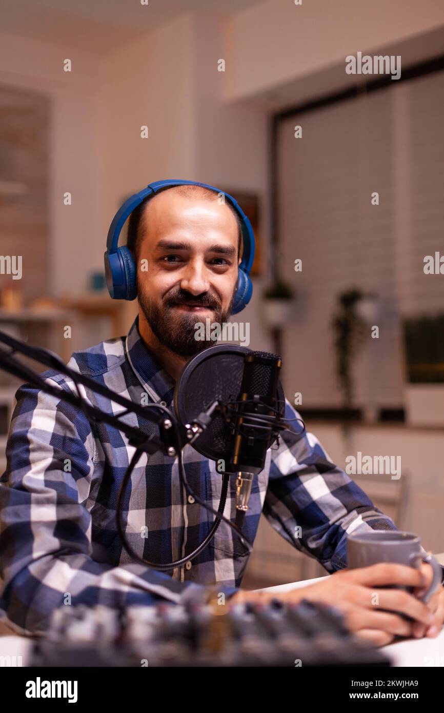 New media star smiling announcing contest winner during his live ...