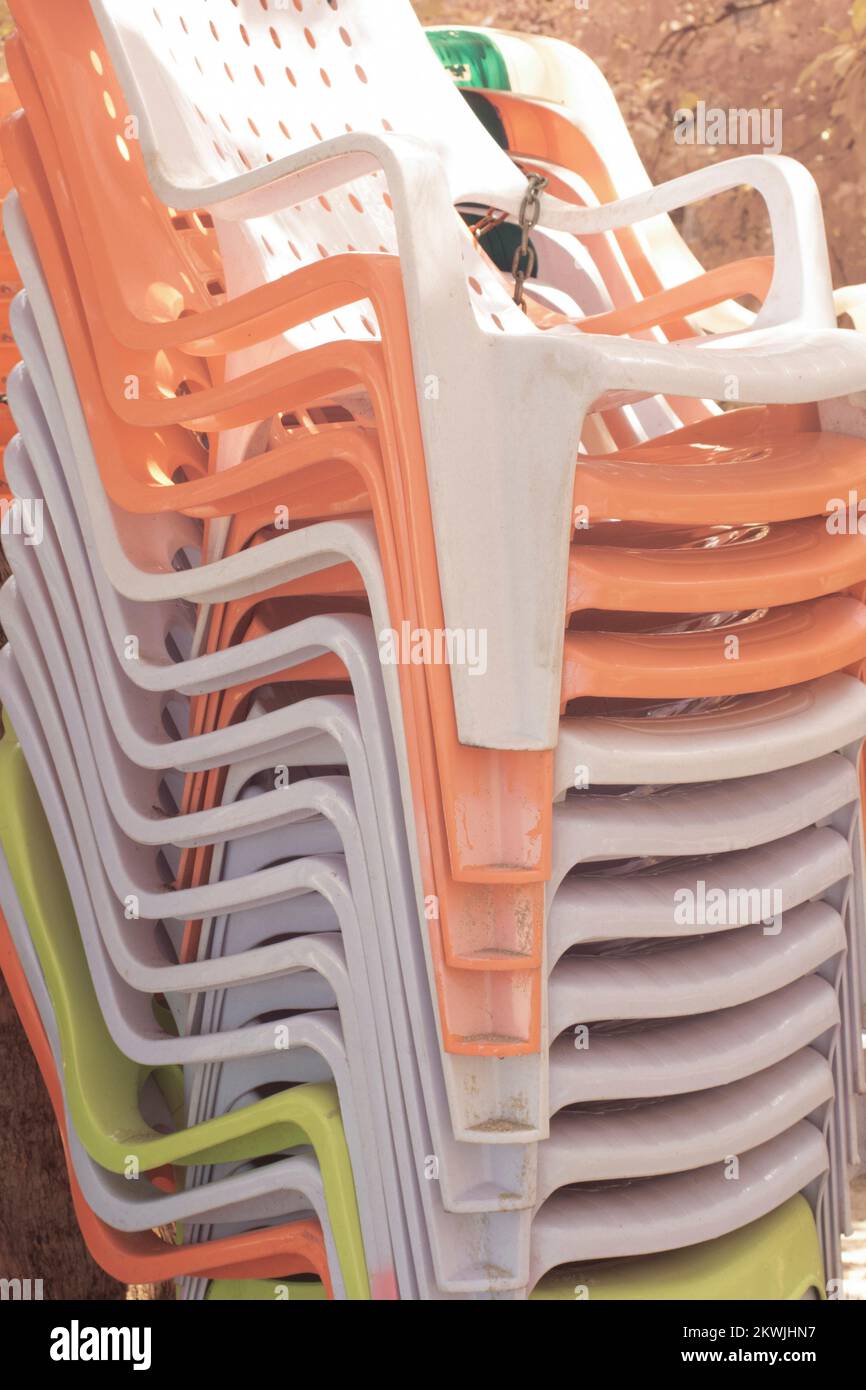 infrared image of the lots of stacked up plastic air chair at the park ...