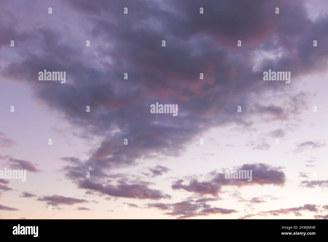 Pink purple clouds in the sky at dusk Stock Photo - Alamy