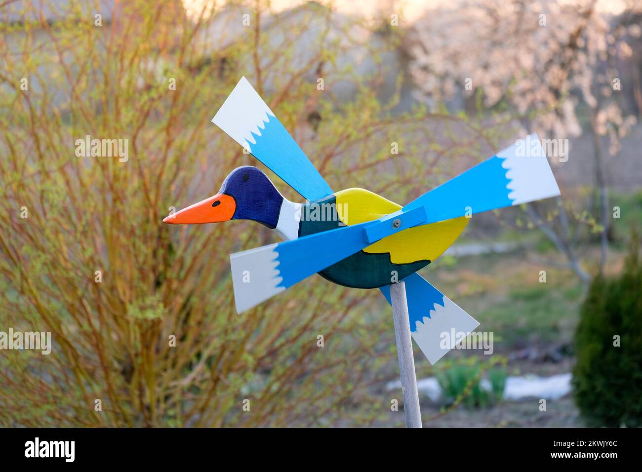 Wooden windmill in the shape of a flying duck in the garden Stock Photo ...
