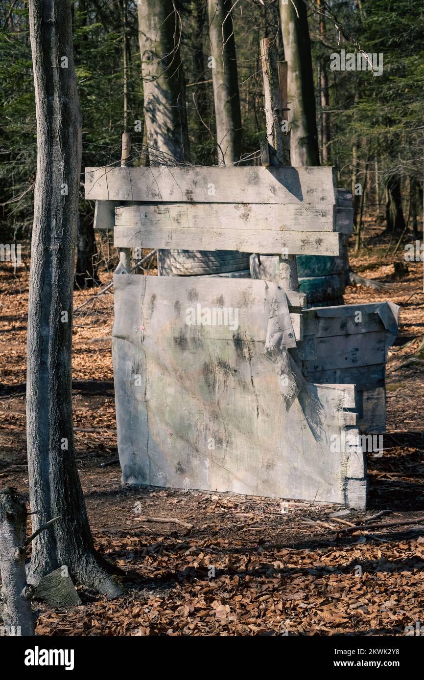 Shelter behind a wooden wall - a bunker in the paintball arena, a ...