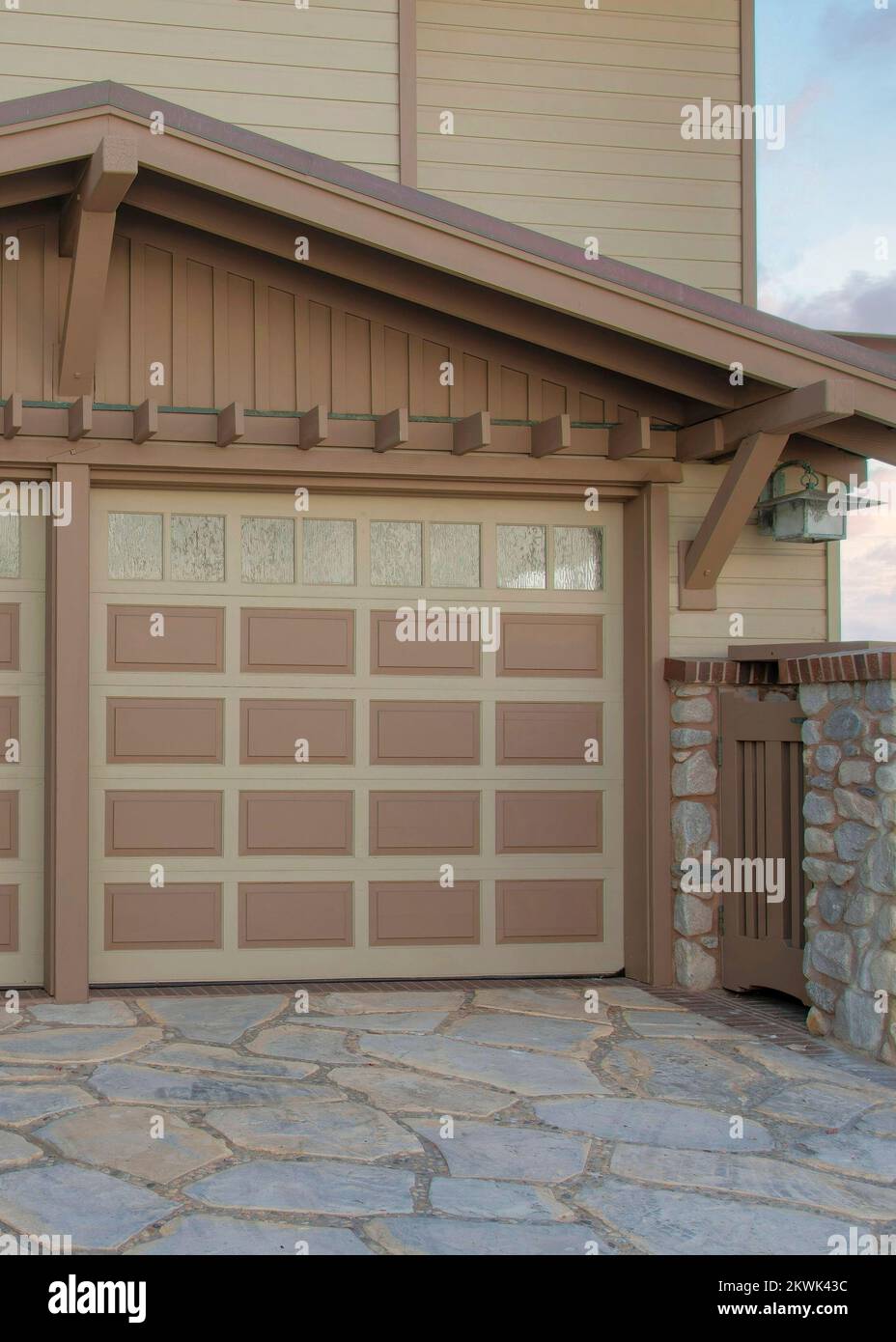 Vertical Puffy clouds at sunset Attached garage exterior with vinyl lap ...
