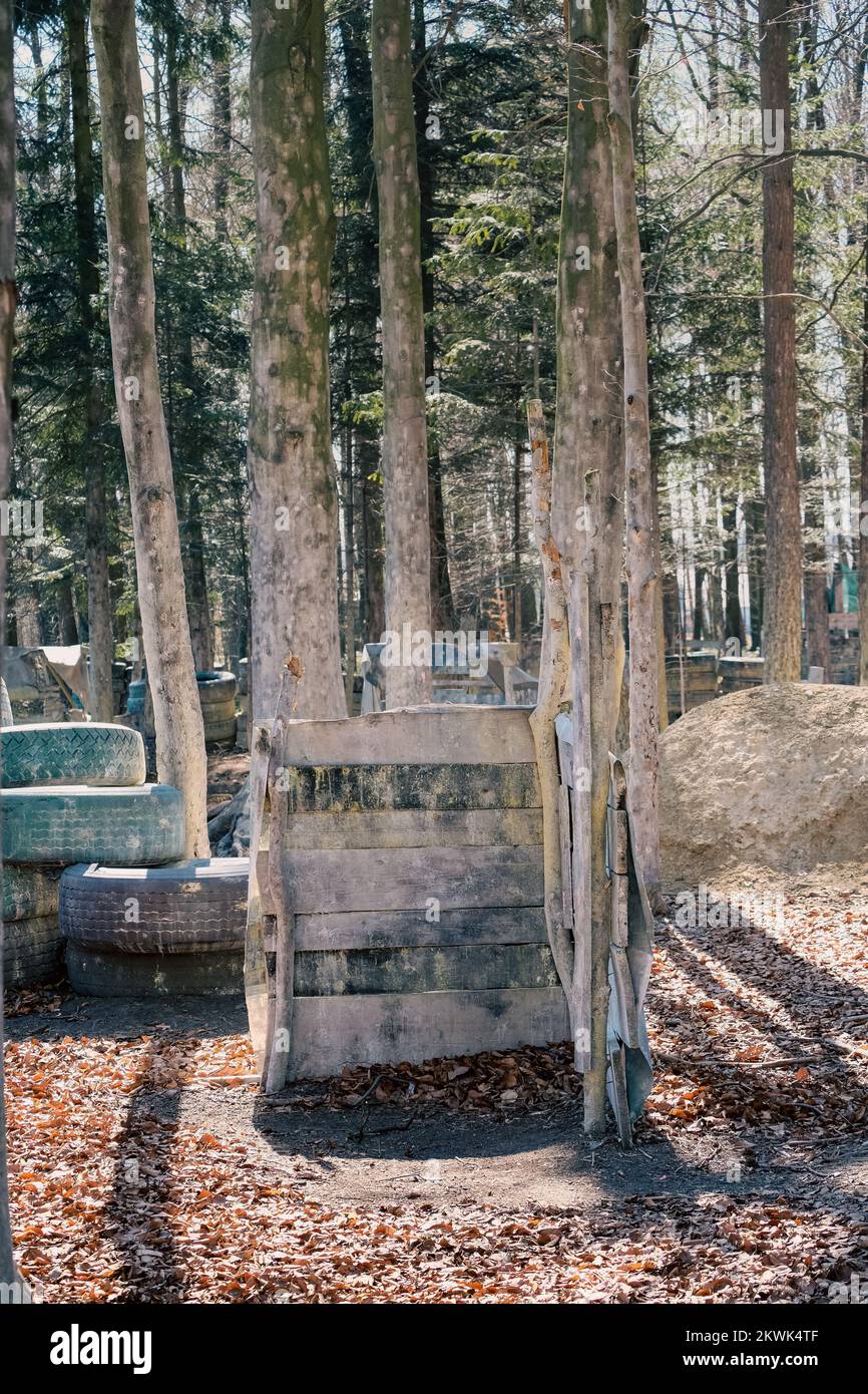 Arena for paintball sports. Fortification in the forest among walls ...