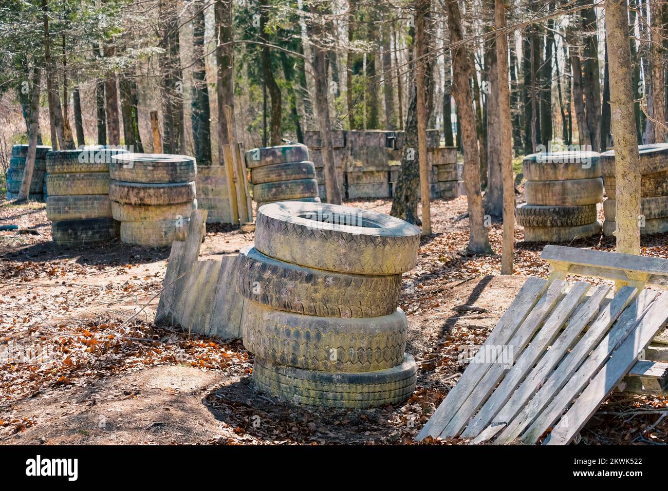 Arena for paintball sports. Fortification in the forest among walls ...