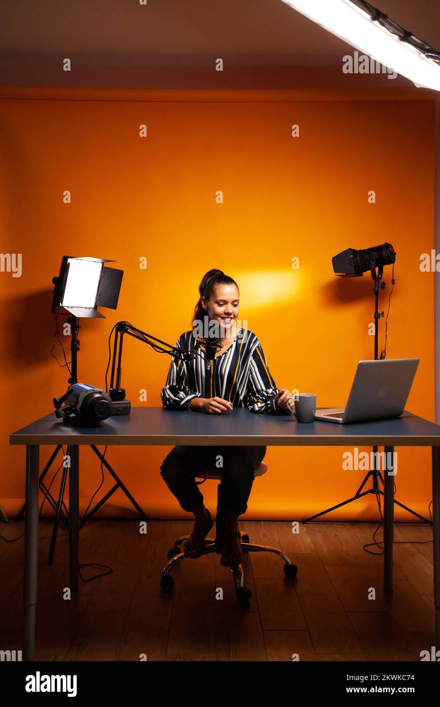 Famous woman filming and recording vlog in home studio. Content creator ...
