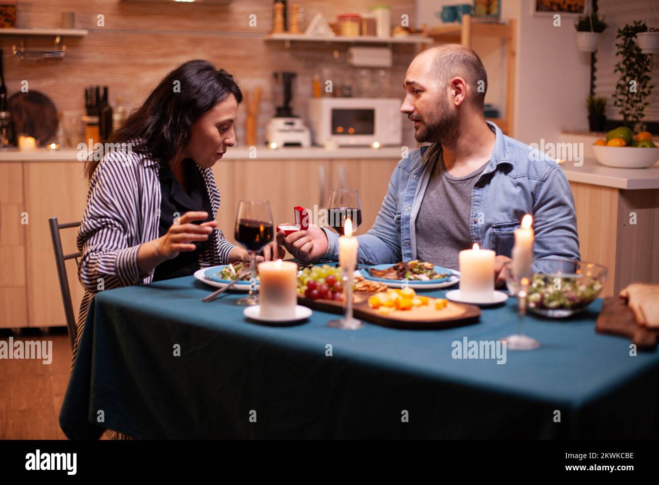 Woman surprised by marriage proposal from husband during romantic ...