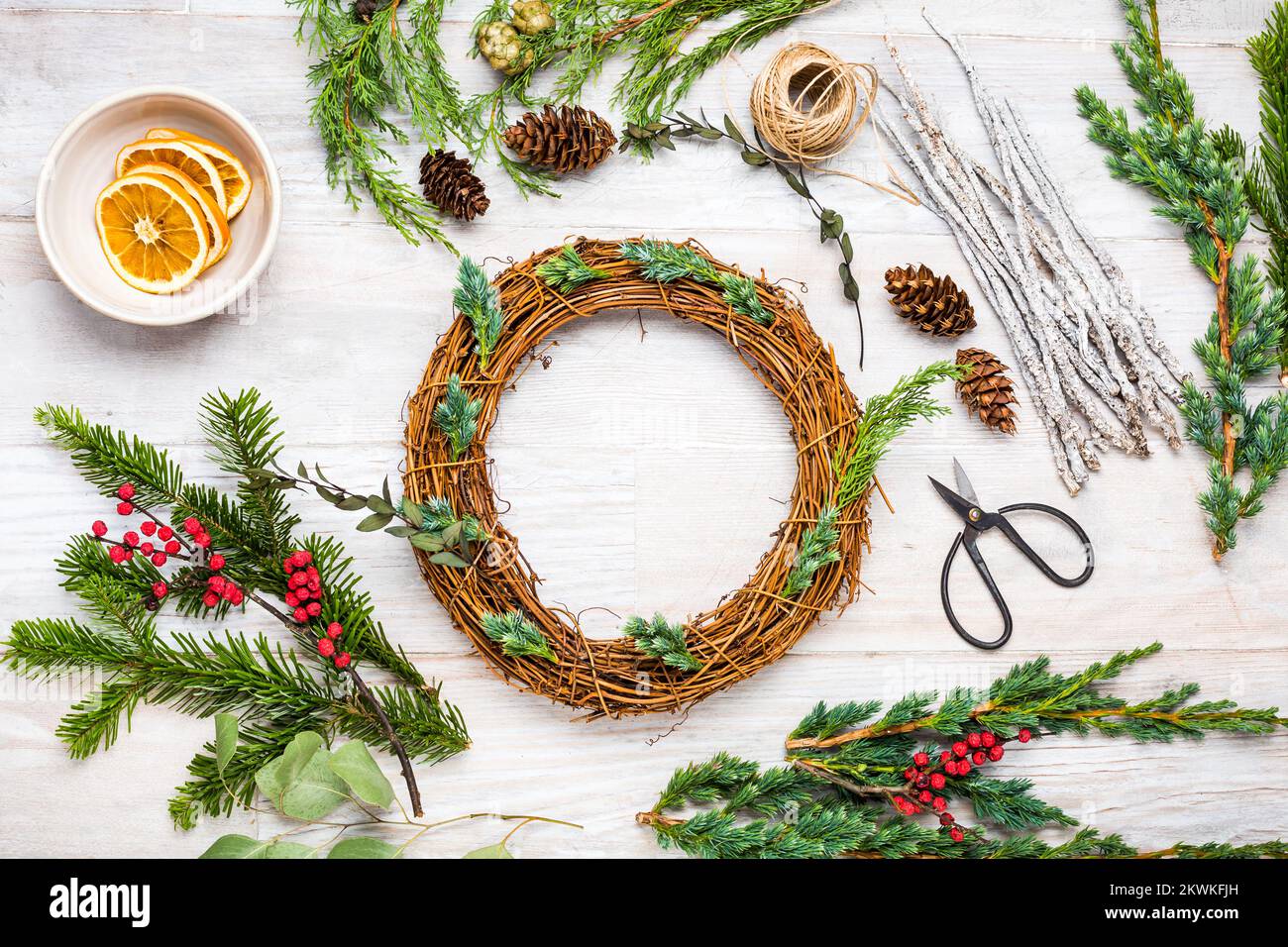 Steps of making christmas door wreath, top down view of florist's ...
