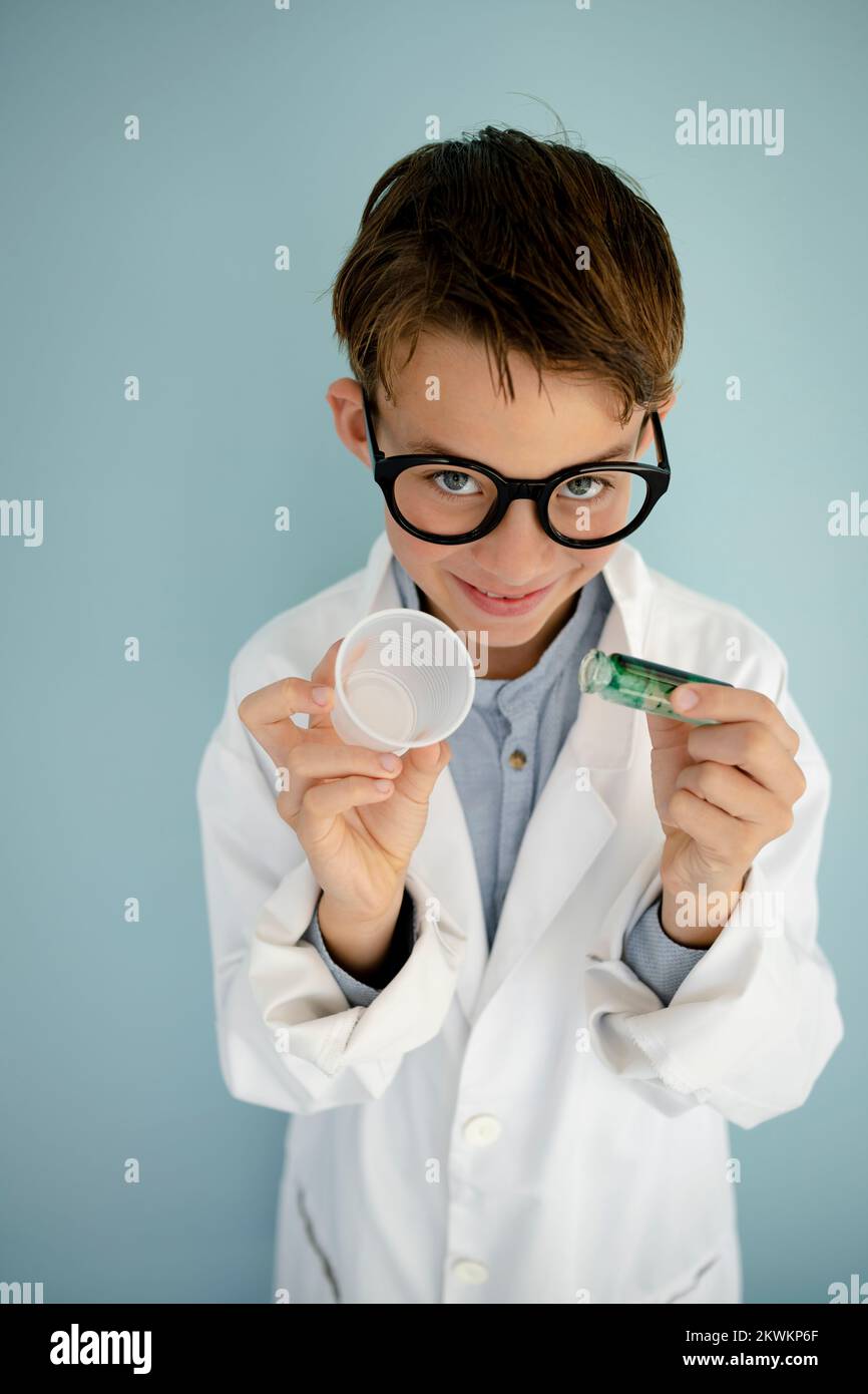 young cool boy ,with big massive black glasses is dressed up as a mad ...