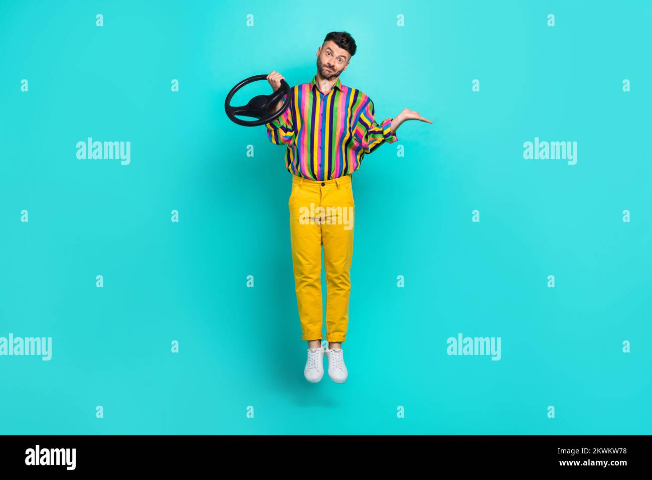 Full body portrait of clueless guy jumping arm hold wheel shrug ...