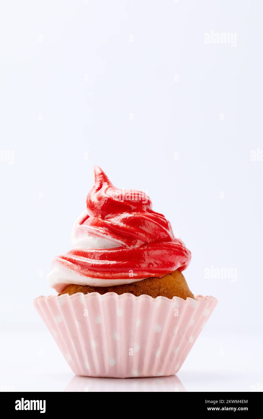 Red cupcake on grey background with copy space Stock Photo - Alamy