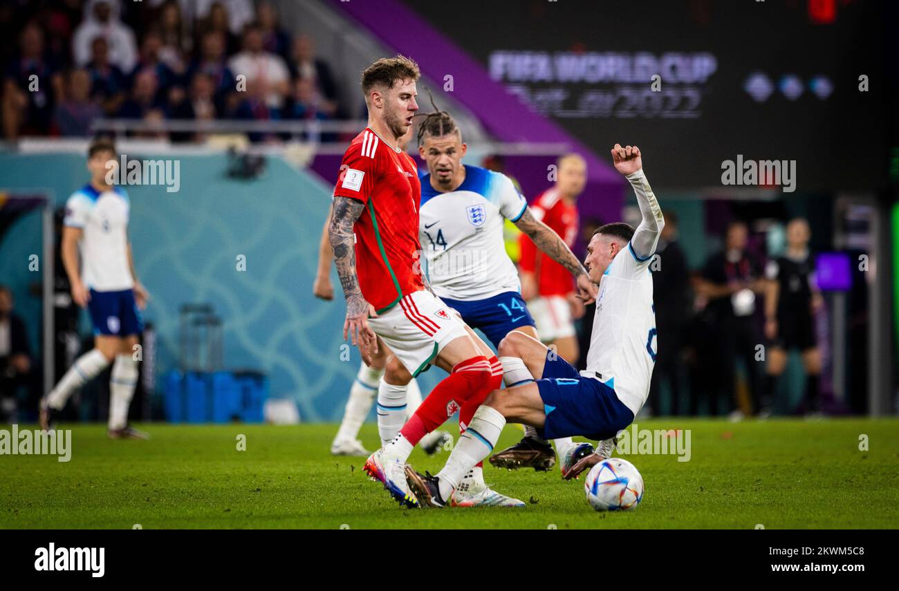 Doha, Qatar. 29th Nov, 2022. Joe Rodon (Wales), Phil Foden (England ...