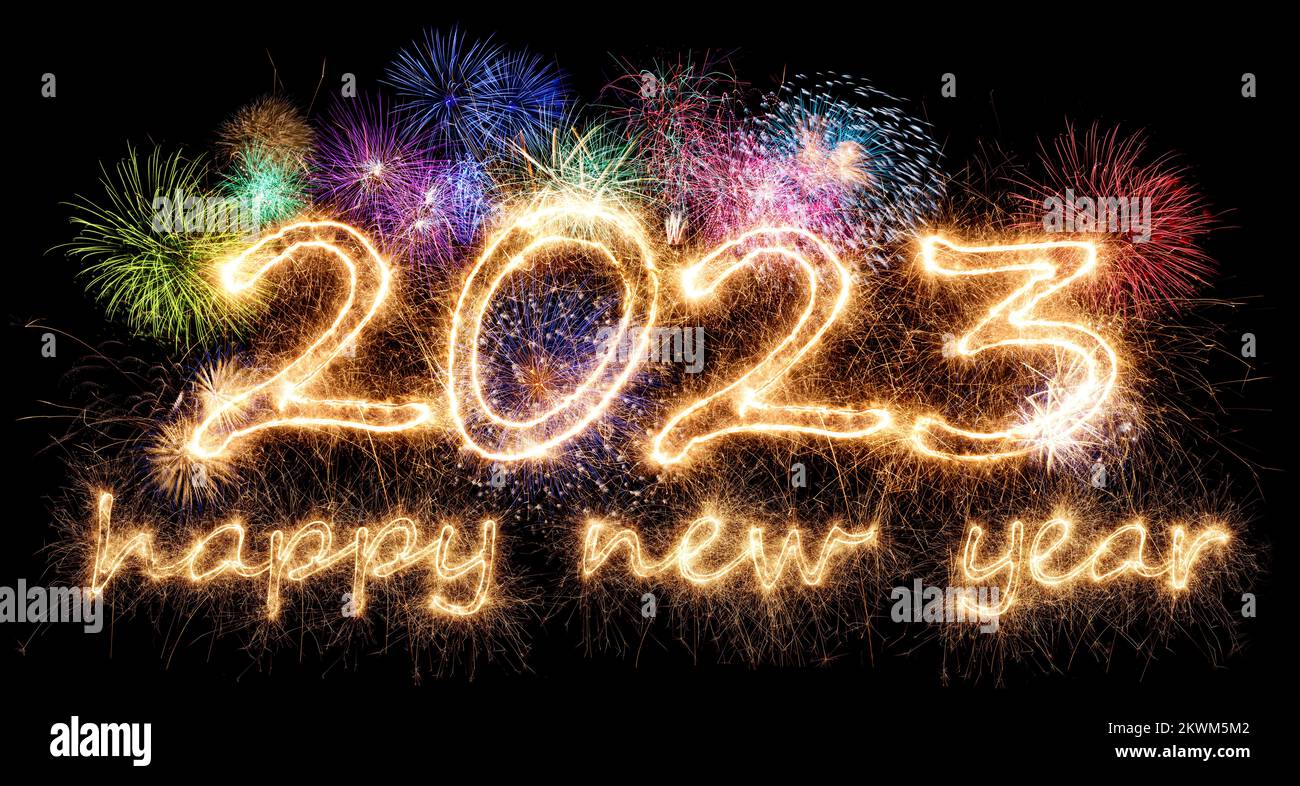 2023 sparkler number with colorful fireworks display on black. happy ...