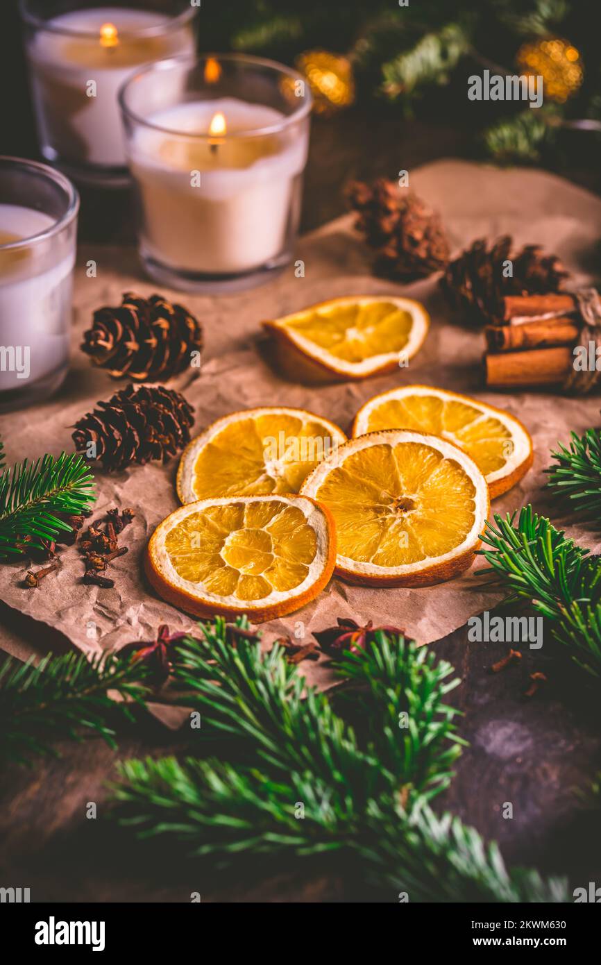 Dried orange and Christmas spices with branches of christmas tree ...