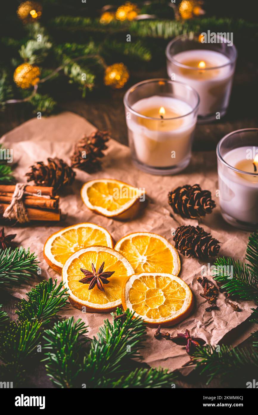 Dried orange and Christmas spices with branches of christmas tree ...